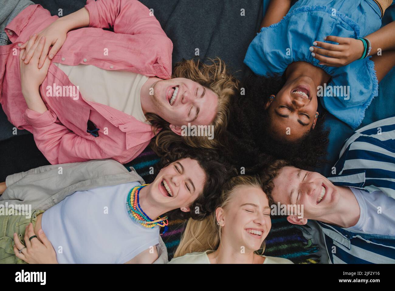 Top view of diverse group of friends having fun together at park ...