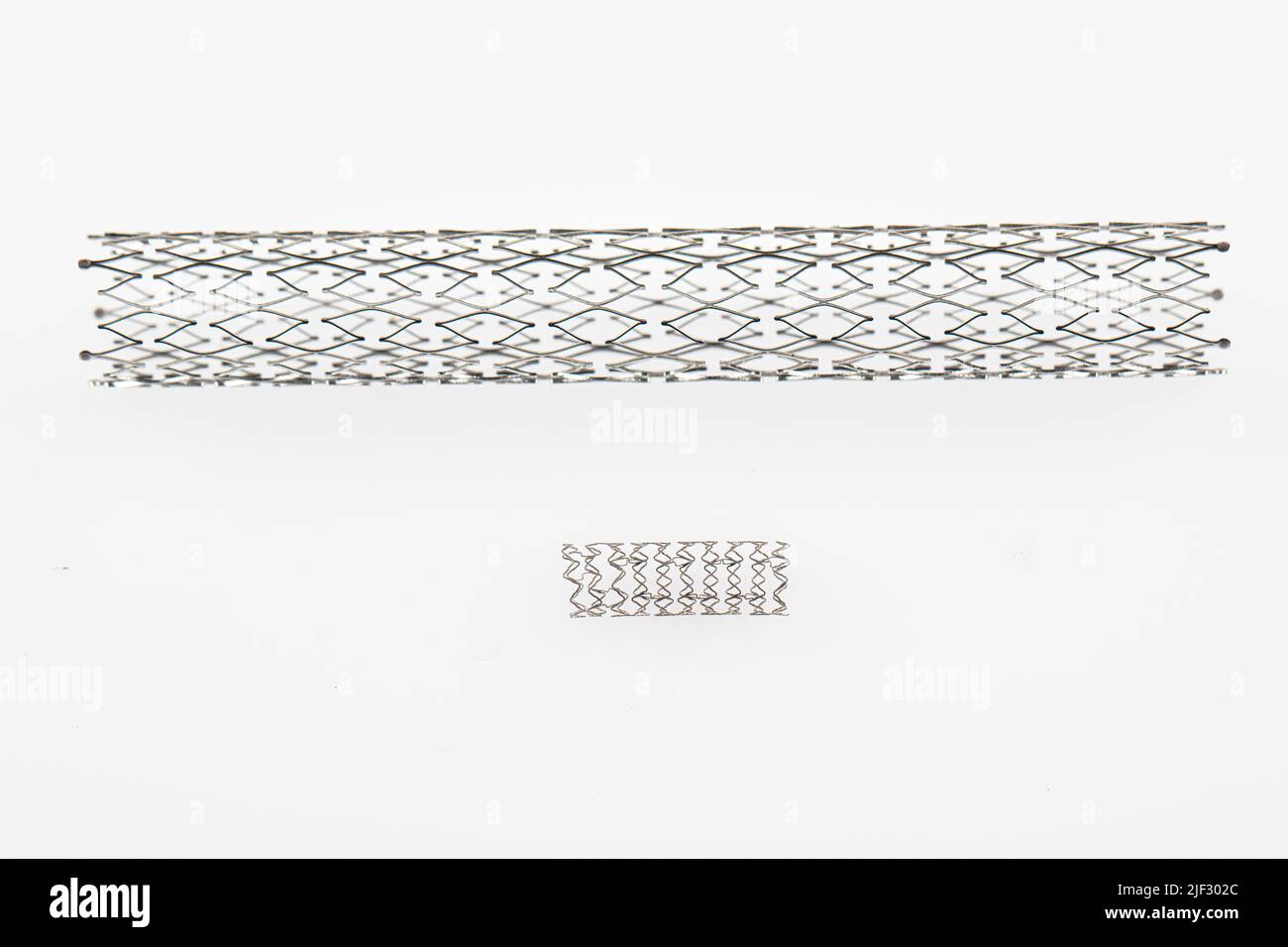 Stent and catheter for implantation into blood vessels with an empty ...