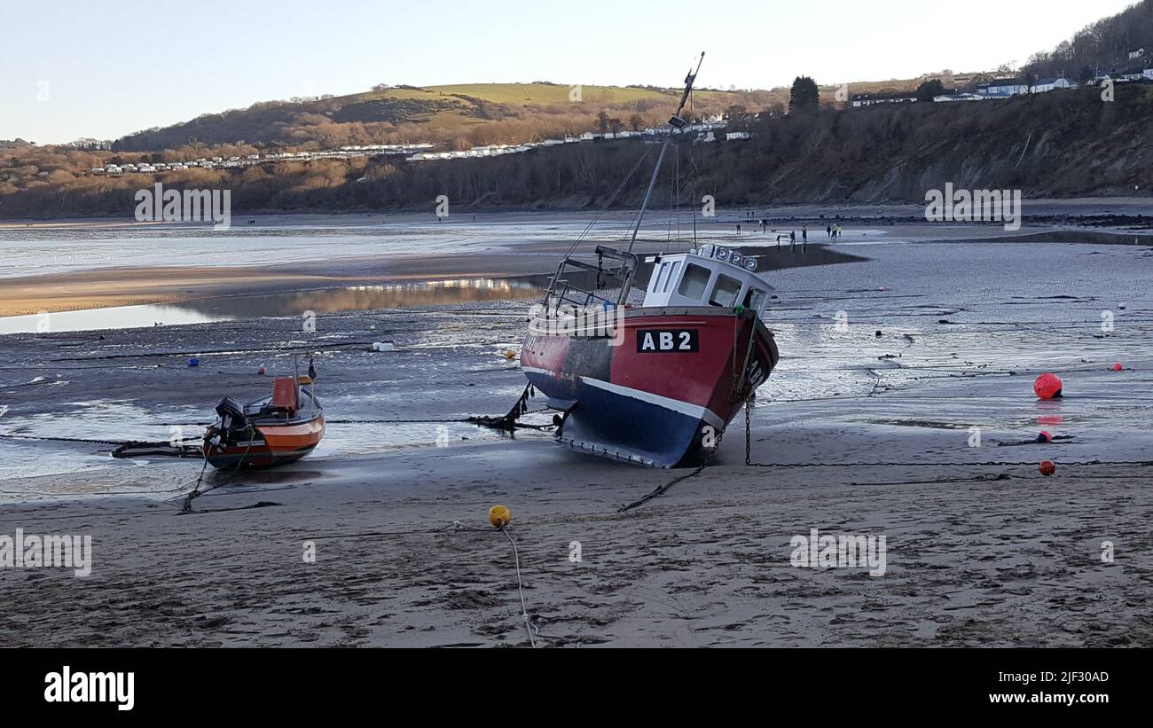 A fishing boat at rest on the New Quay harbor in UK Stock Photo - Alamy