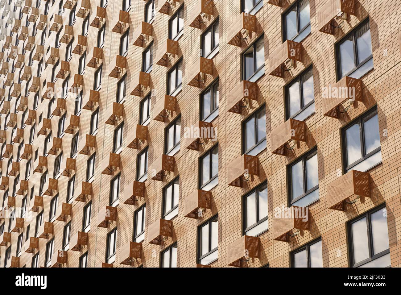 Facade of a new multi-apartment high-rise residential building with ...