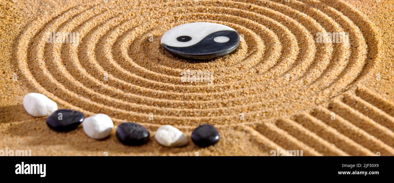 Japanese ZEN garden with yin yang stones in textured sand Stock Photo ...