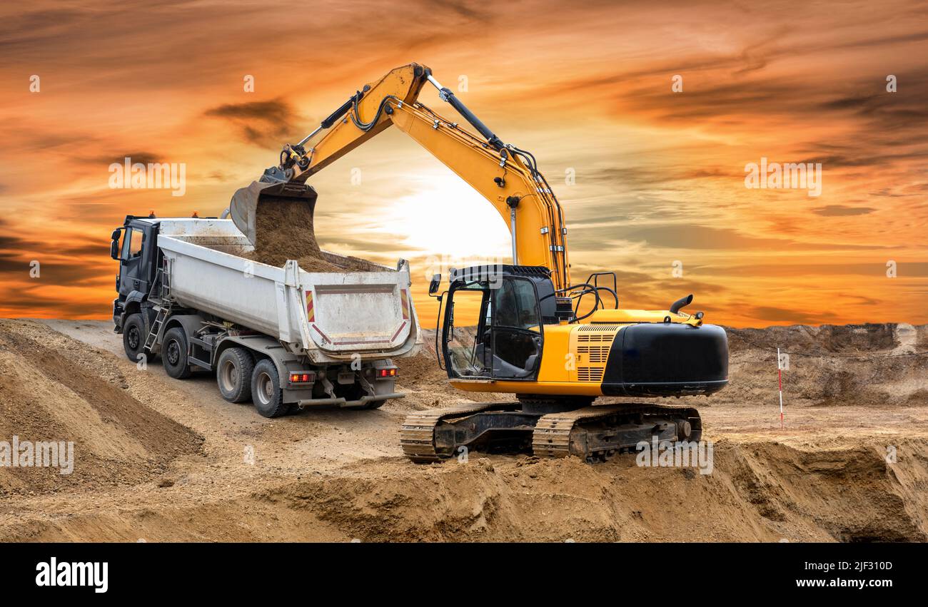 excavator is digging on construction site Stock Photo - Alamy