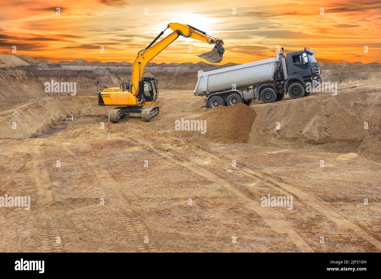 excavator is digging on construction site Stock Photo - Alamy