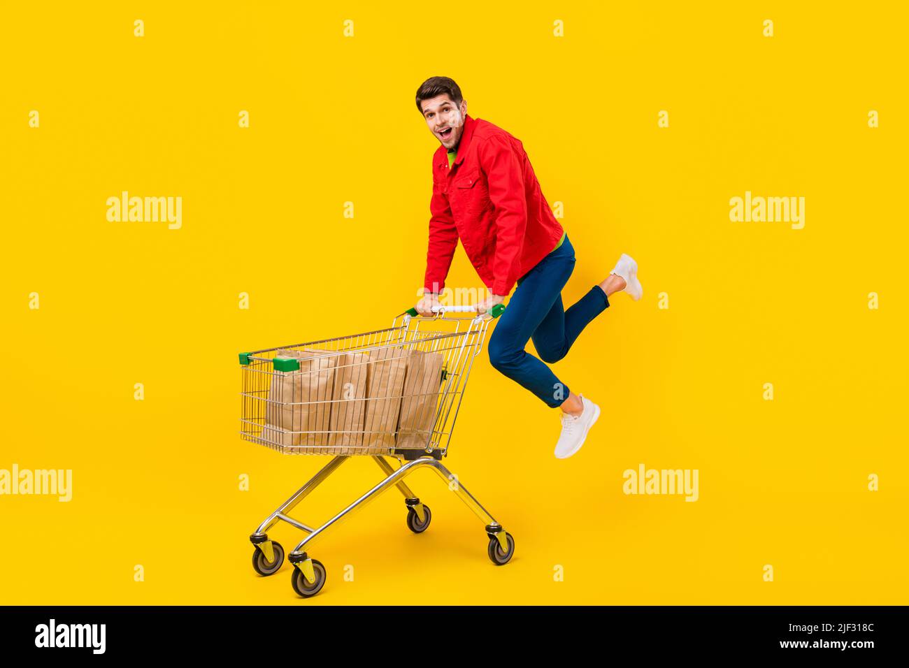 Full length body size view of attractive funny cheerful guy holding ...