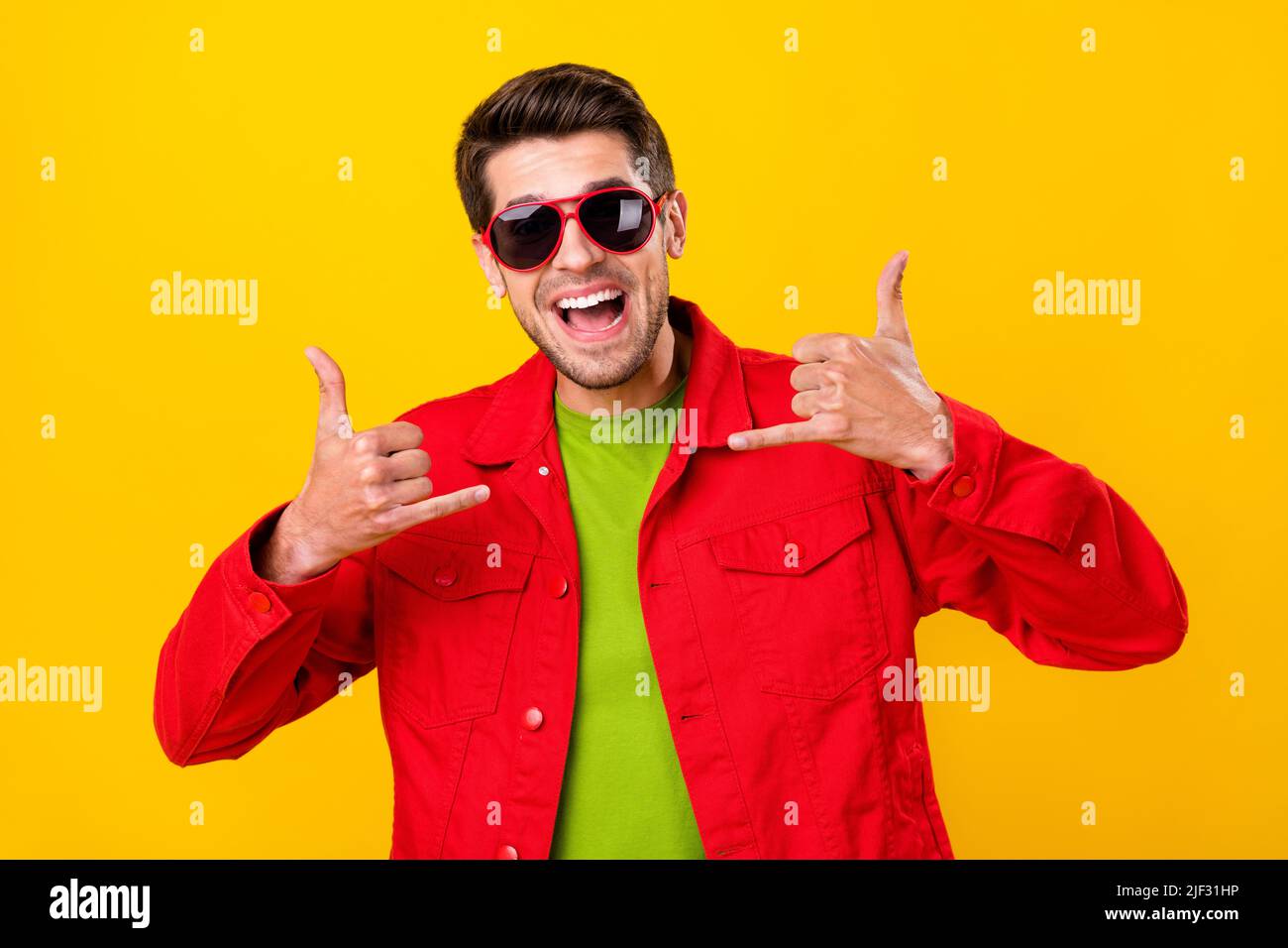 Photo of impressed young guy ask to call wear glasses red jacket ...
