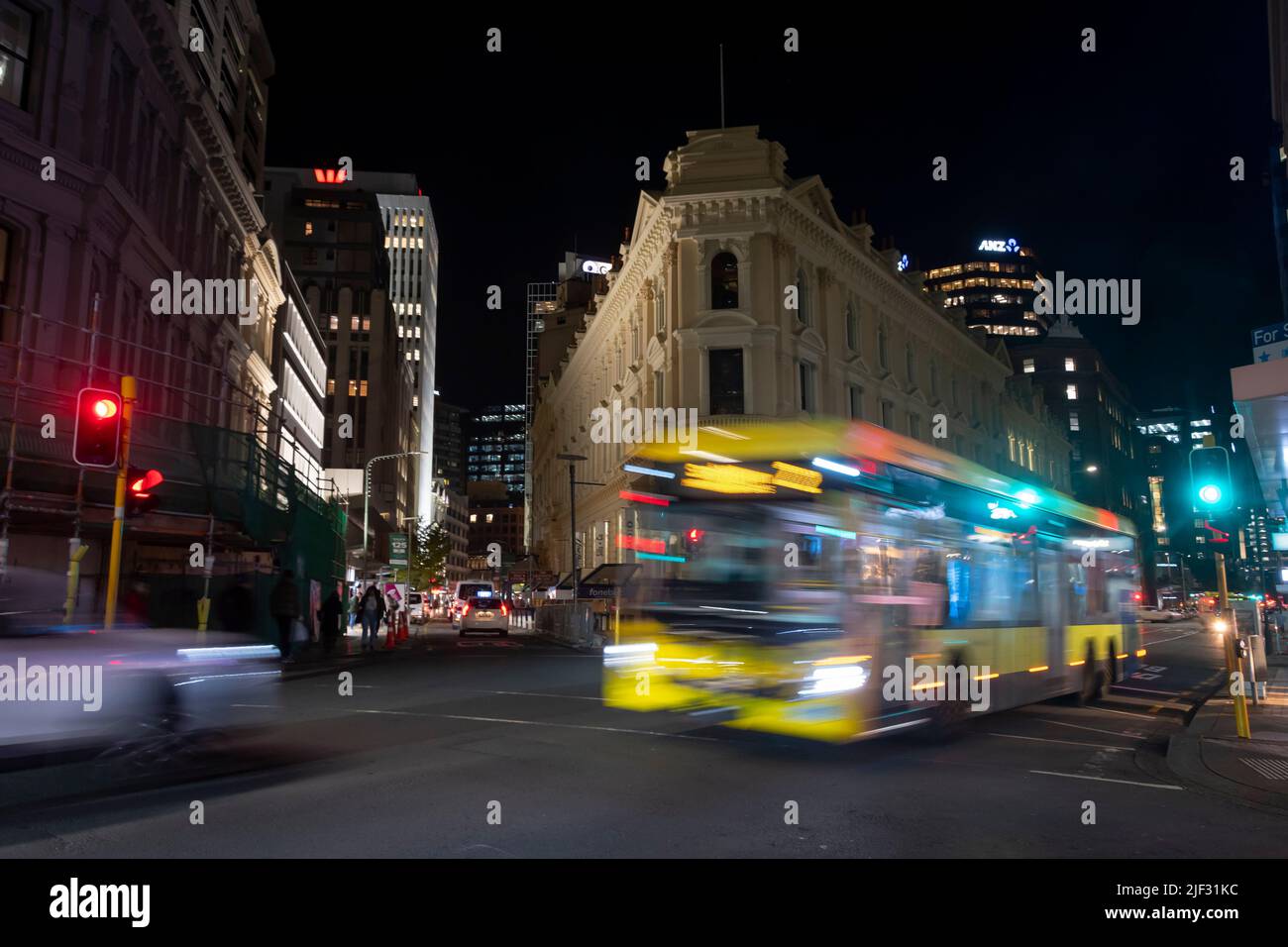 Bus in central business district at night, Wellington, North Island ...