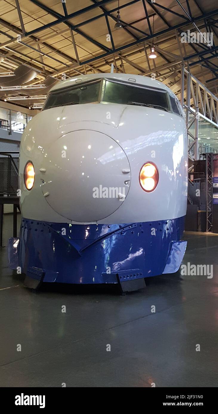 A vertical shot of a Japanese bullet train that is accessible to the ...