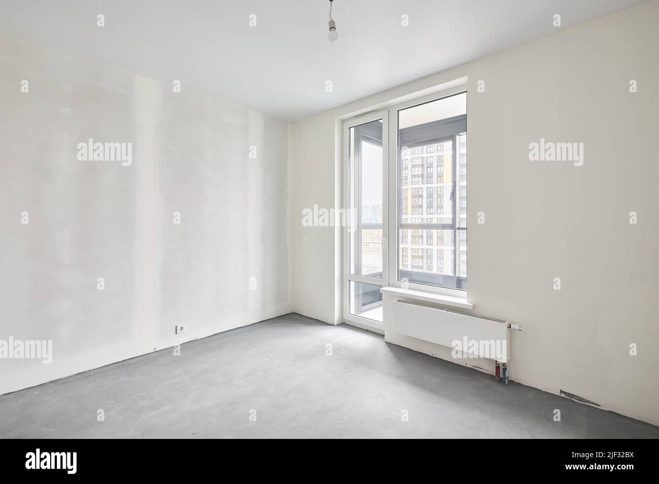 Interior of new apartment without finishing in gray tones Stock Photo ...