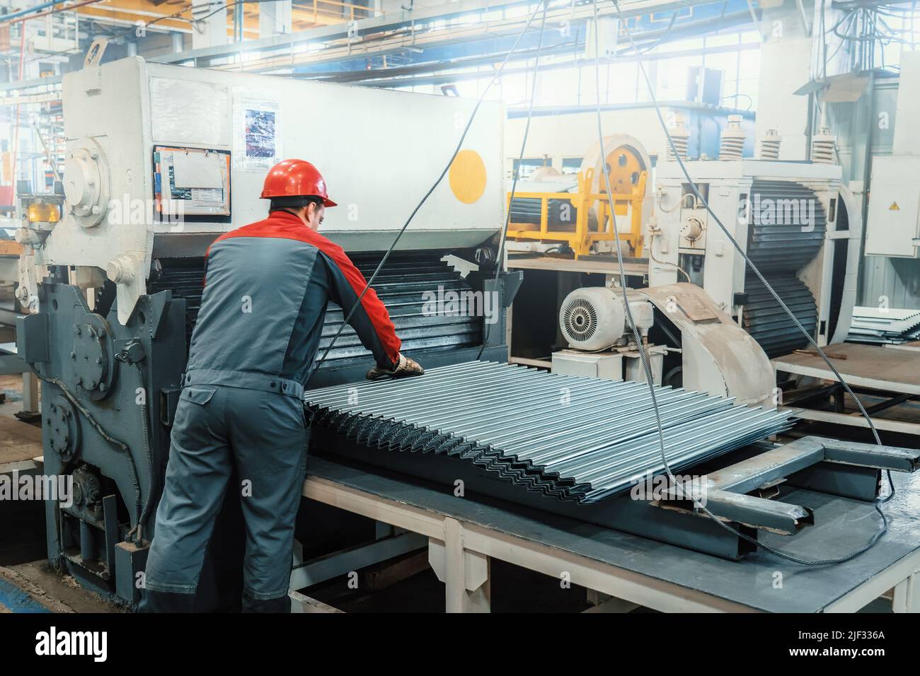 Metal sheet forming machine production line at metalwork factory ...