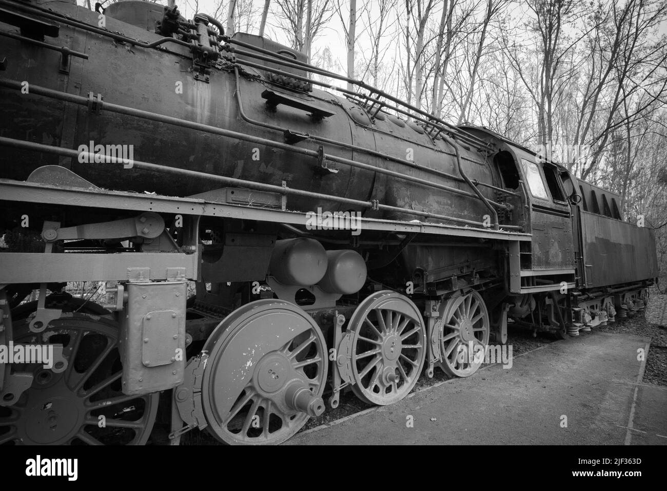 Steam locomotive in black white, parked at a terminal station ...