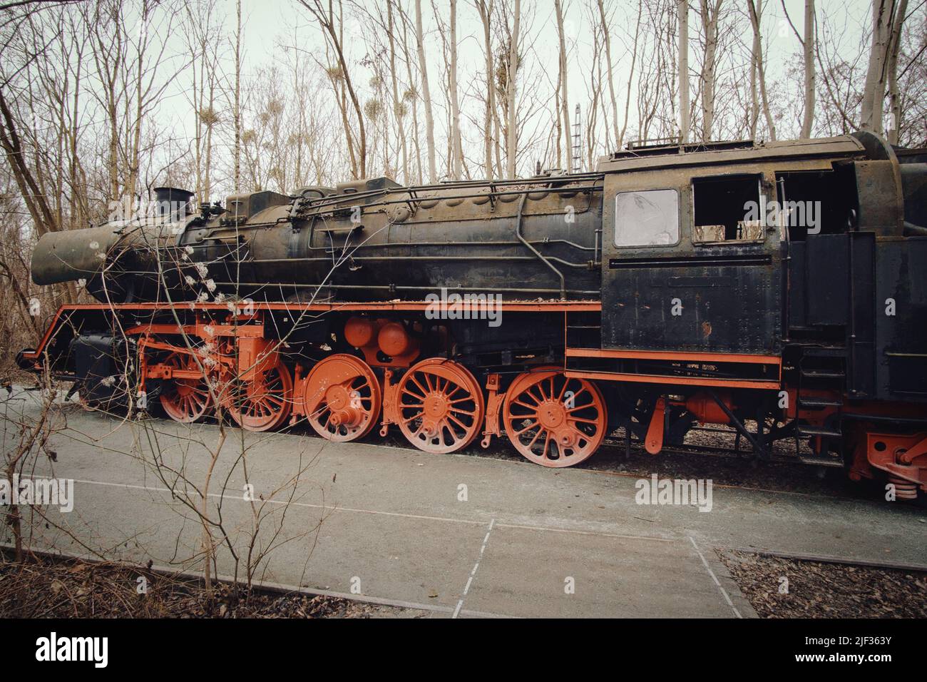Steam locomotive parked at a terminal station. Historical railroad from ...