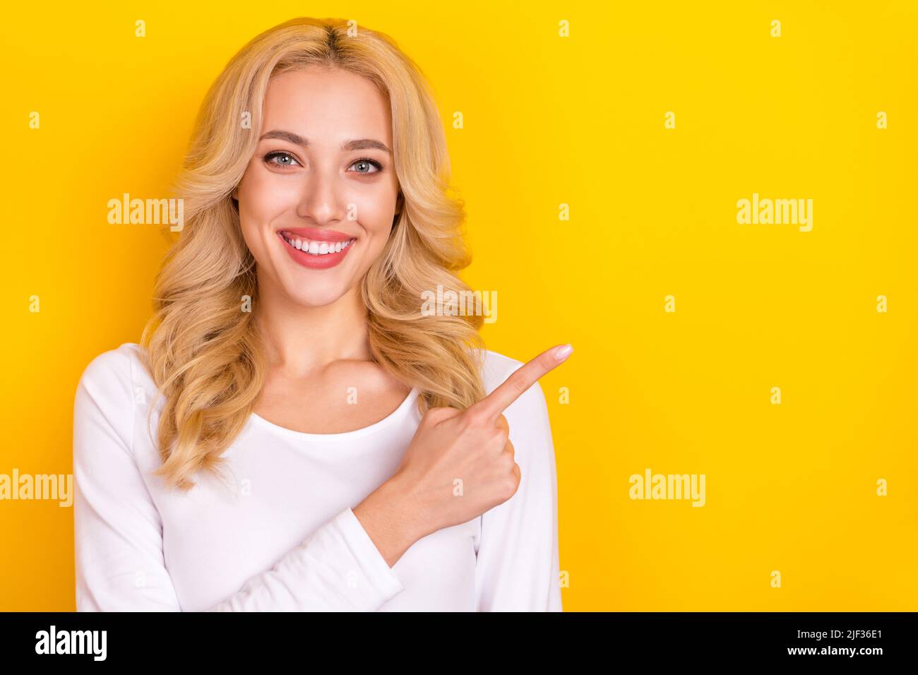 Photo of funky adorable lady dressed white shirt pointing empty space ...