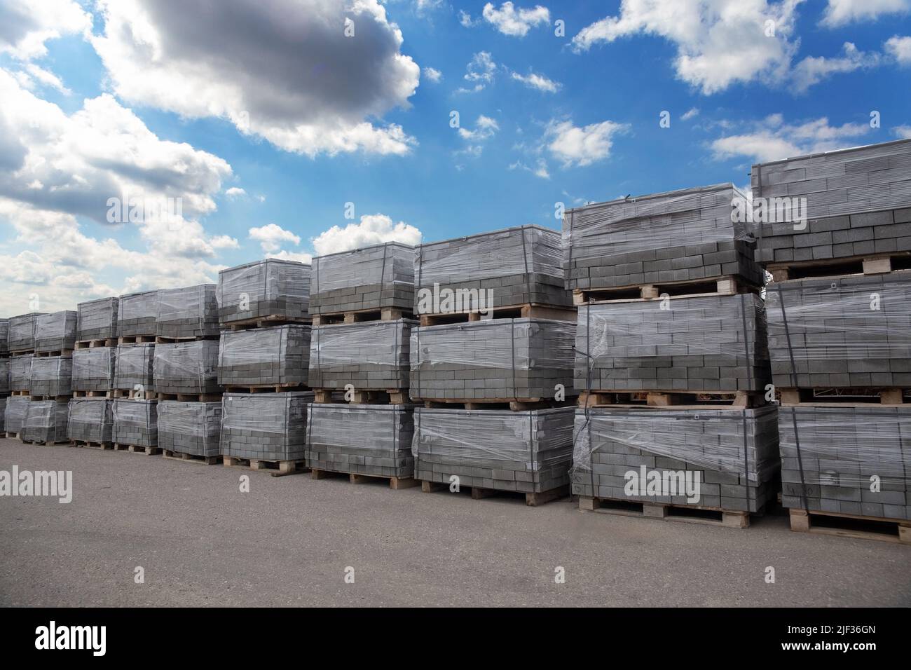 Pallets with gray paving slabs. Background with copy space for text or ...