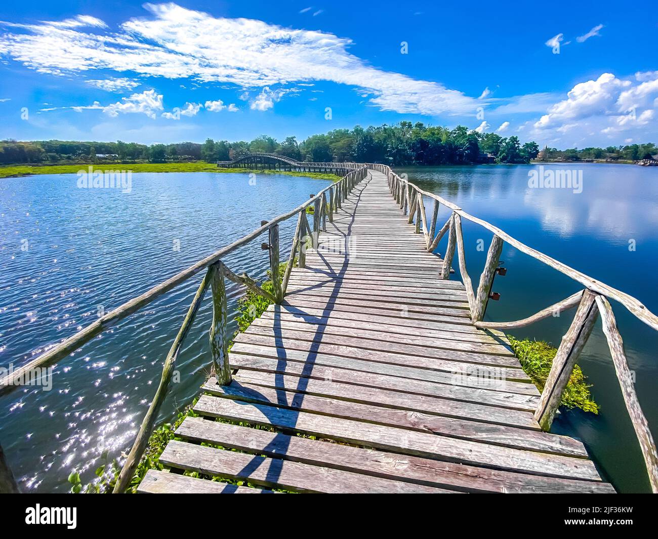 Nong Yai Pond and Wooden Bridge in Chumphon, Thailand Stock Photo - Alamy