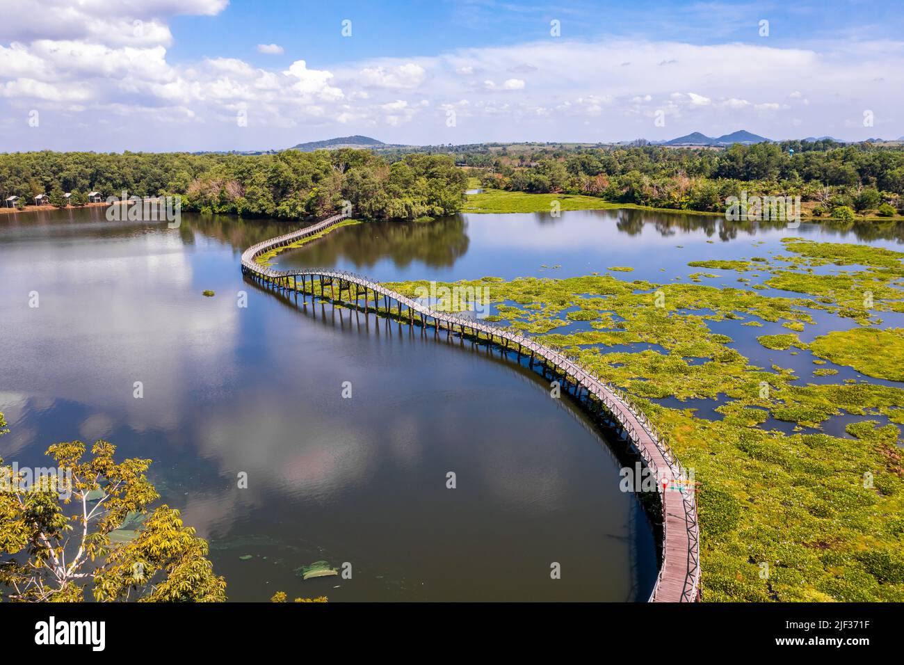 Nong Yai Pond and Wooden Bridge in Chumphon, Thailand Stock Photo - Alamy