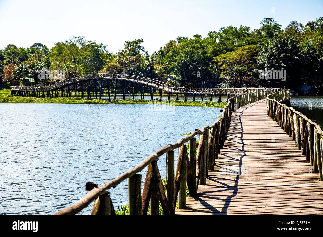 Nong Yai Pond and Wooden Bridge in Chumphon, Thailand Stock Photo - Alamy