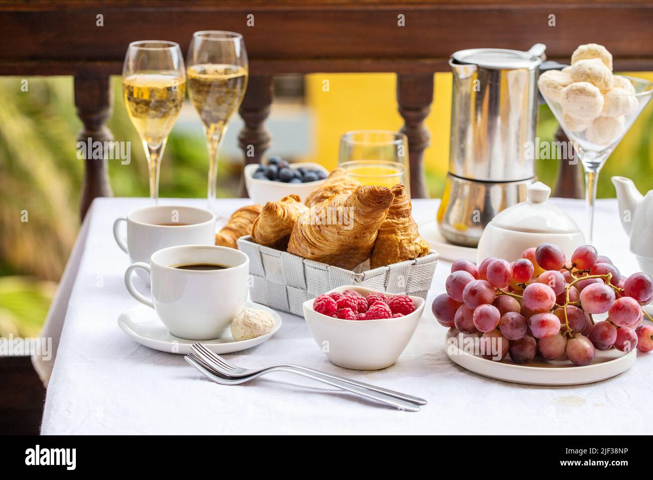 Luxury brunch on the hotel terrace, coffee maker, teapot, cups ...