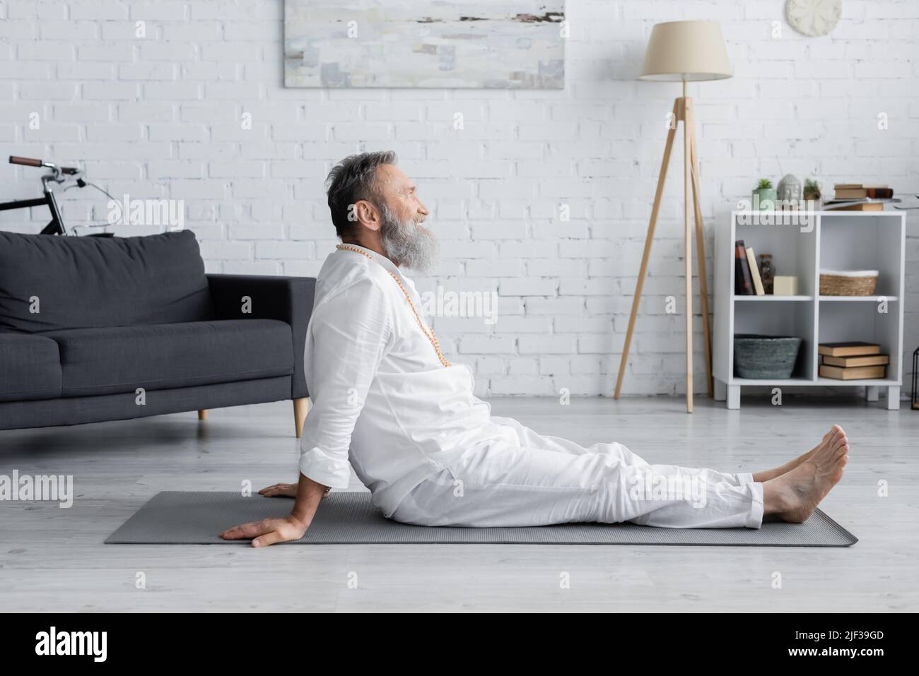 Elderly man sitting barefoot on hi-res stock photography and images - Alamy