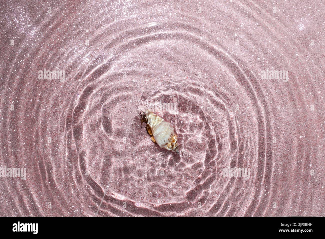 Closeup transparent clear water, surface vortex texture with splashes ...