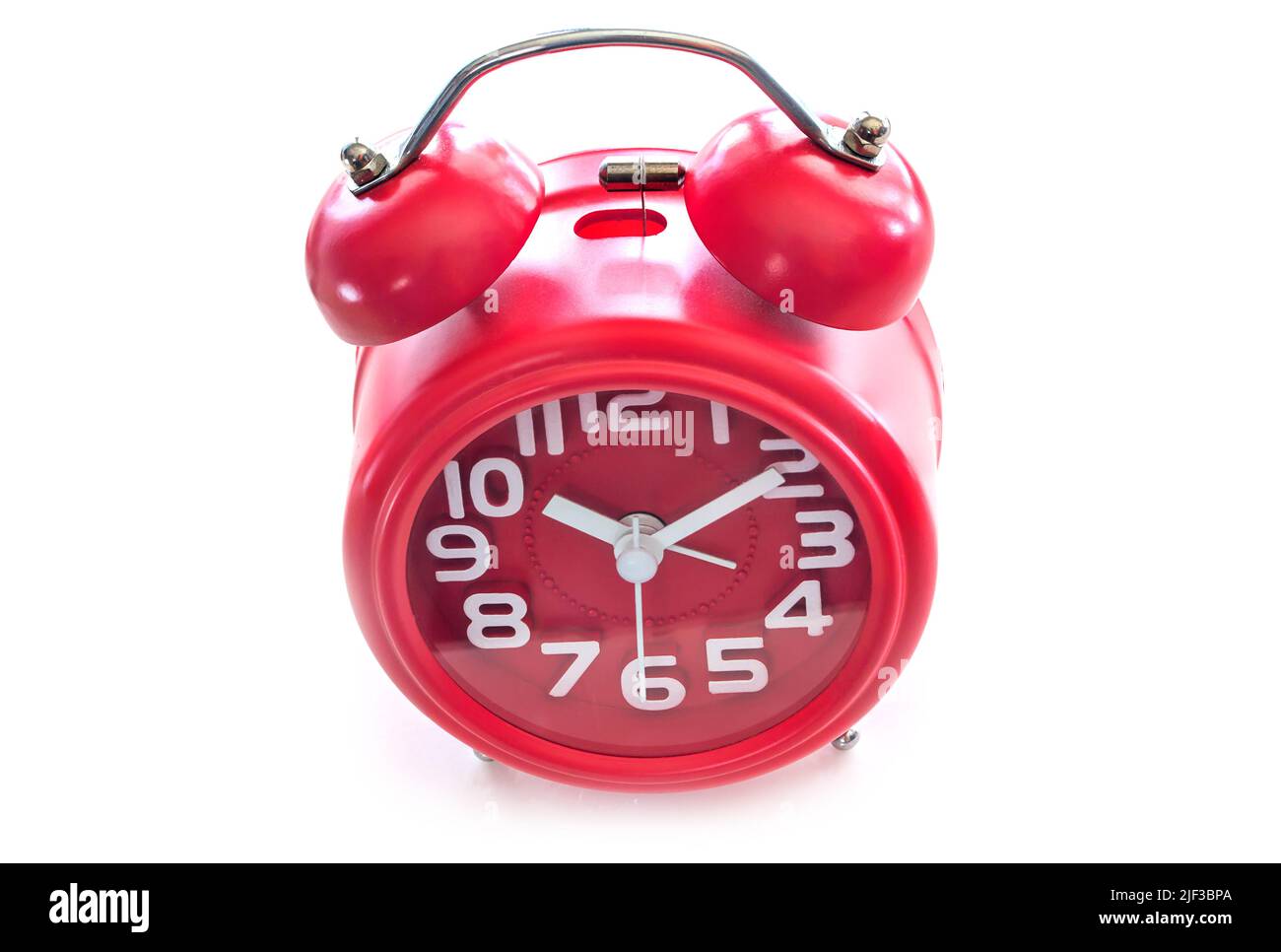 Red vintage alarm clock on a white background Stock Photo - Alamy