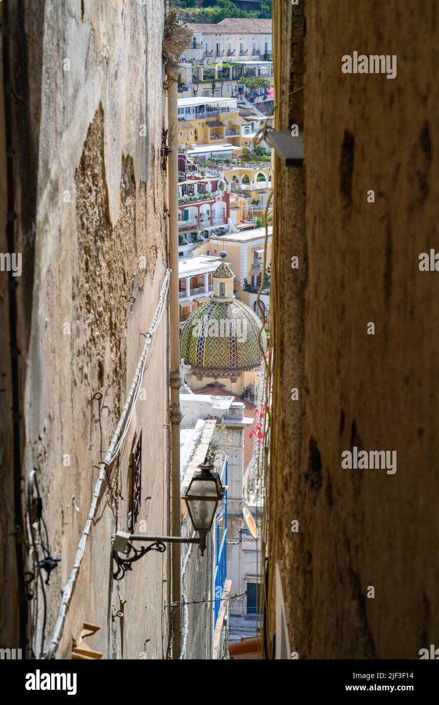 Narrow view of a Church dome through buildings in Italy Stock Photo - Alamy
