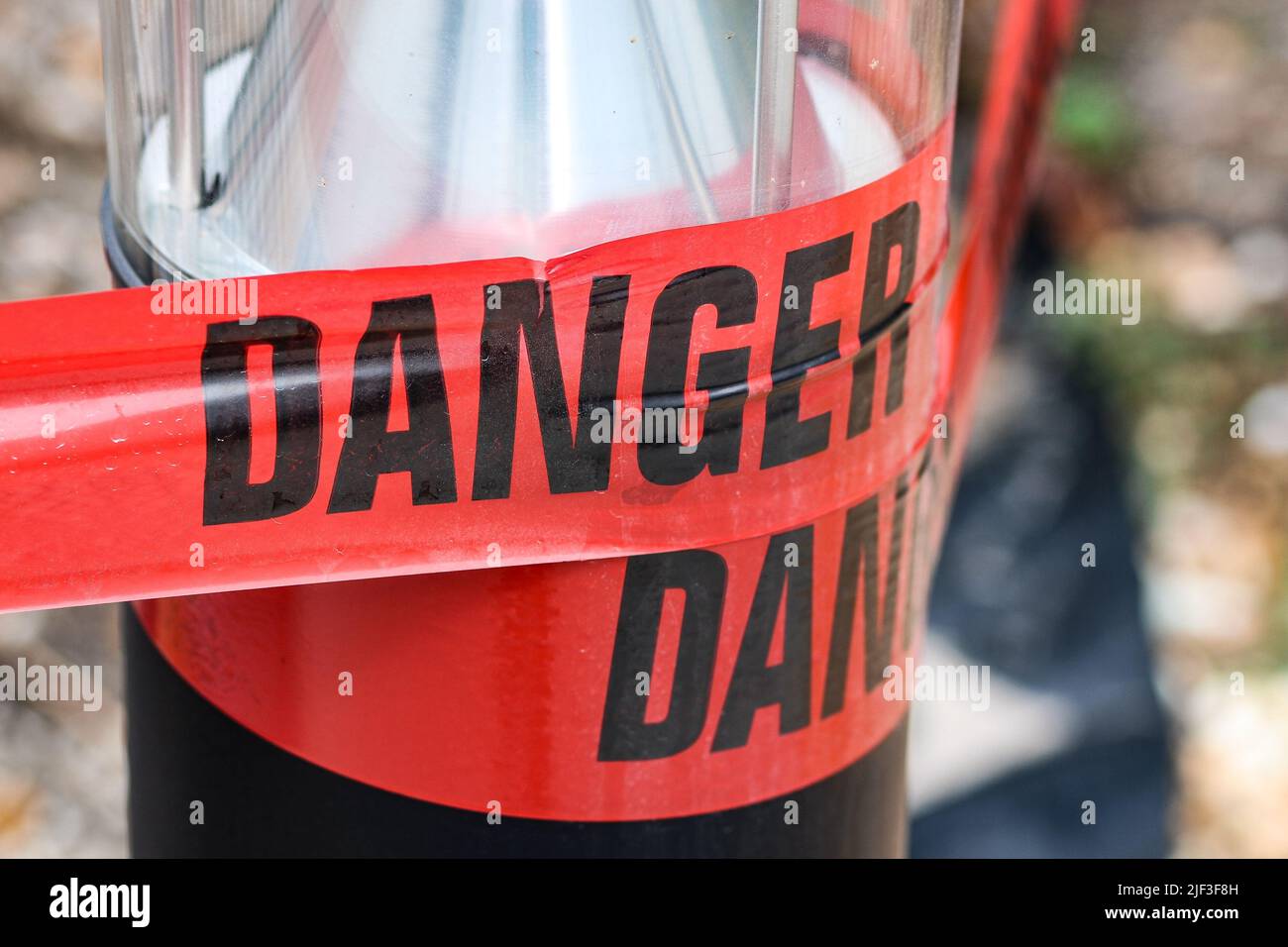 A closeup shot of red Danger warning tape - barricade barrier tape ...