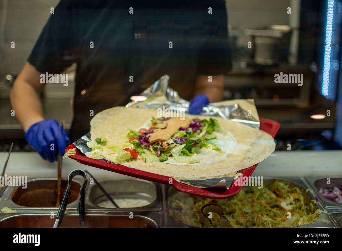 making a kebab in a restaurant Stock Photo - Alamy