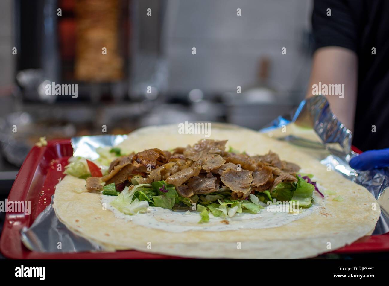 making a kebab in a restaurant Stock Photo - Alamy