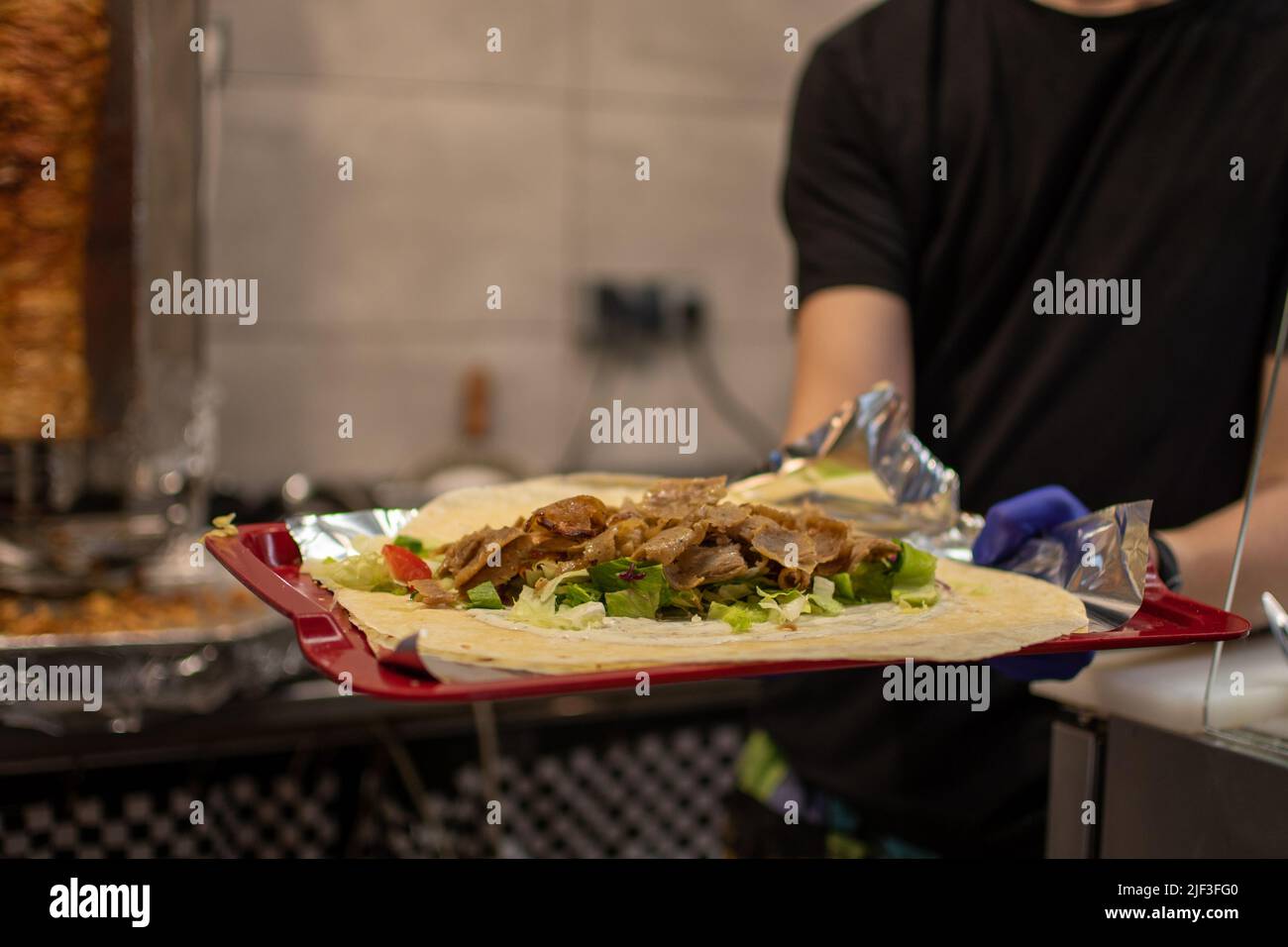 making a kebab in a restaurant Stock Photo - Alamy