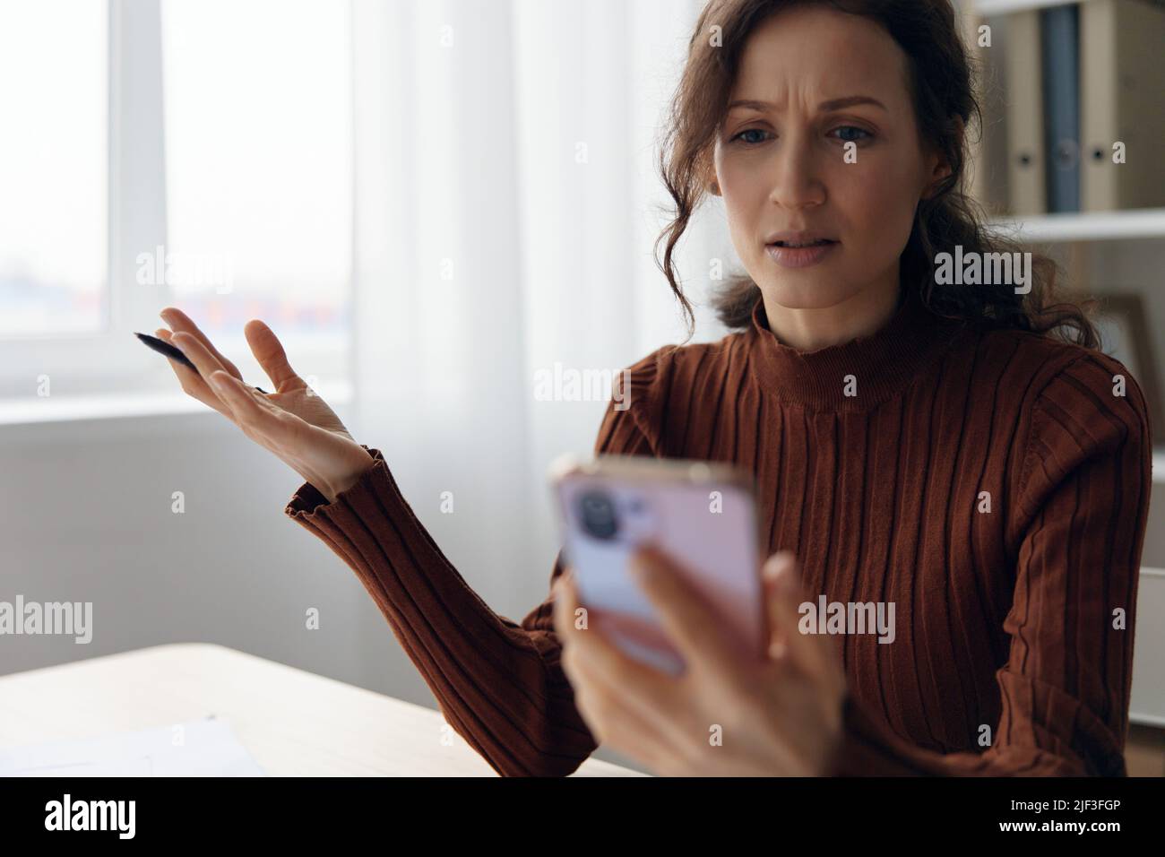 Financial troubles concept. Irritated angry evil curly pretty woman don ...