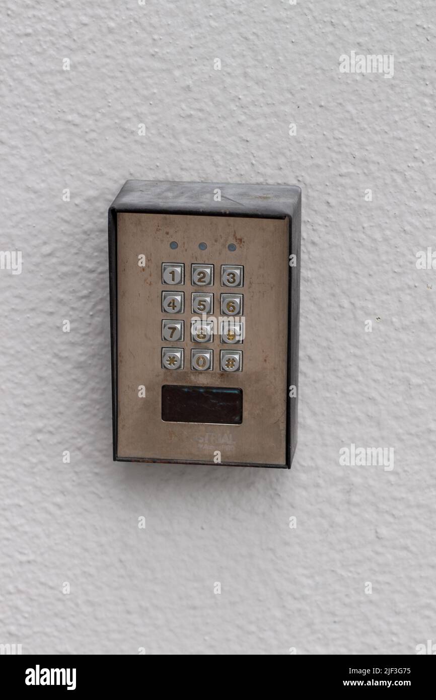 A vertical shot of an old entry keypad that provides secure entry for ...