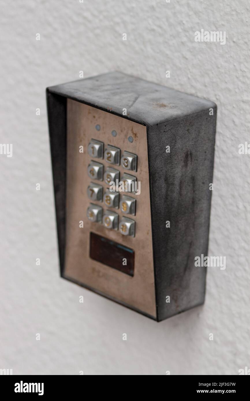 A vertical shot of an old entry keypad that provides secure entry for ...