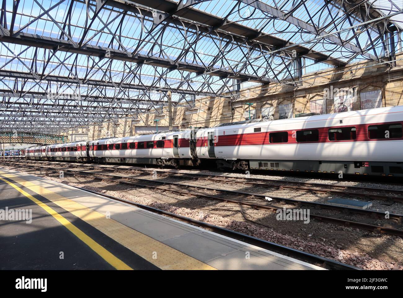 LNER Azuma train standing at platform 4 beneath the train shed roof at ...