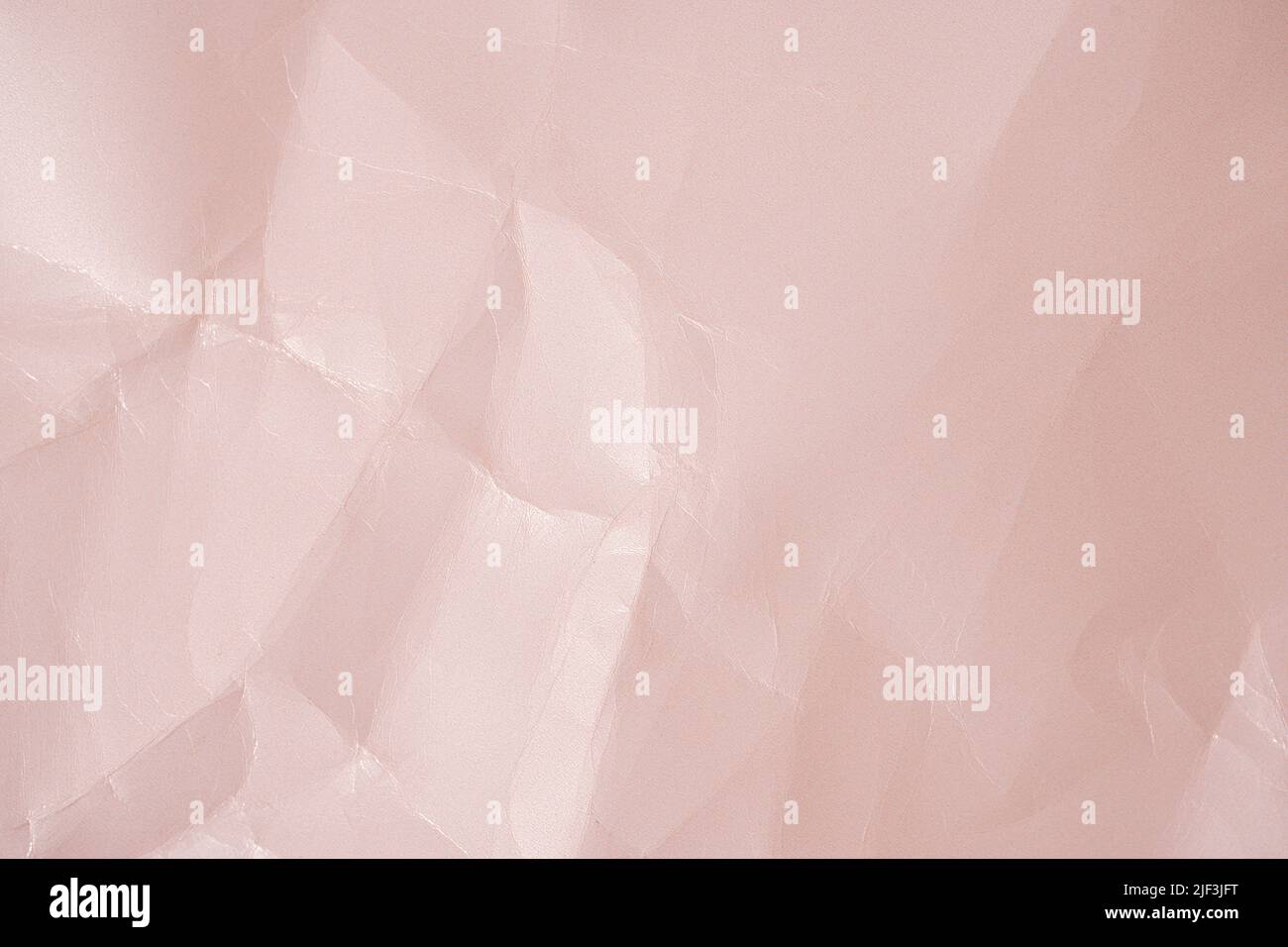 empty wrinkled pink pearl tissue paper textured background. text space ...