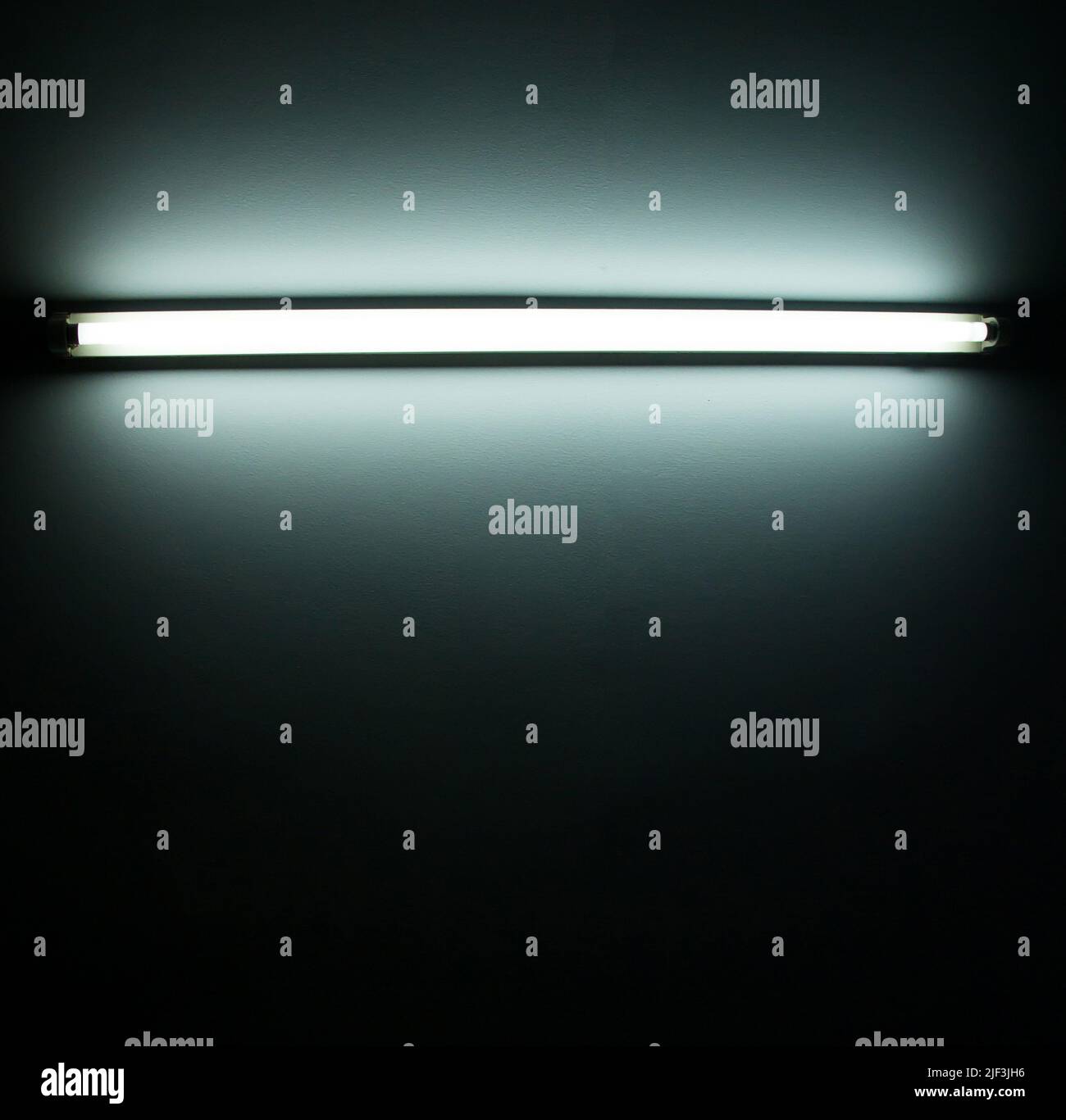 Detail of a fluorescent light tube on a wall. fluorescent light tube ...