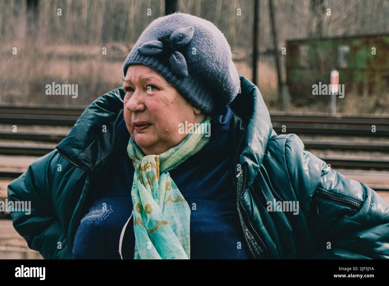 A woman is waiting†at the train station to get on a train to Budapest ...