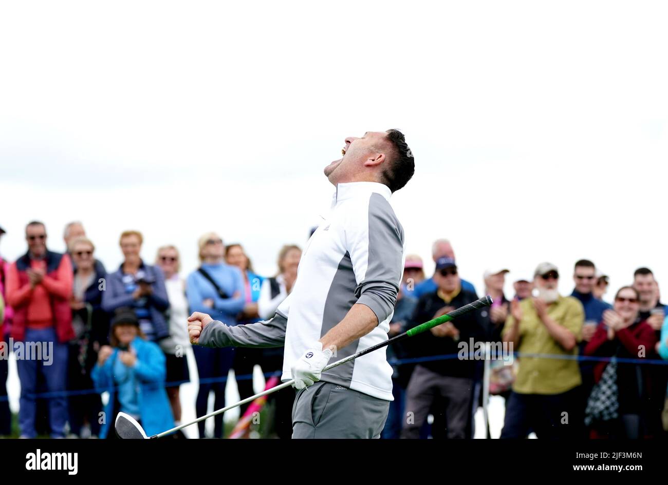 Former footballer Robbie Keane celebrates after teeing off on the 1st ...