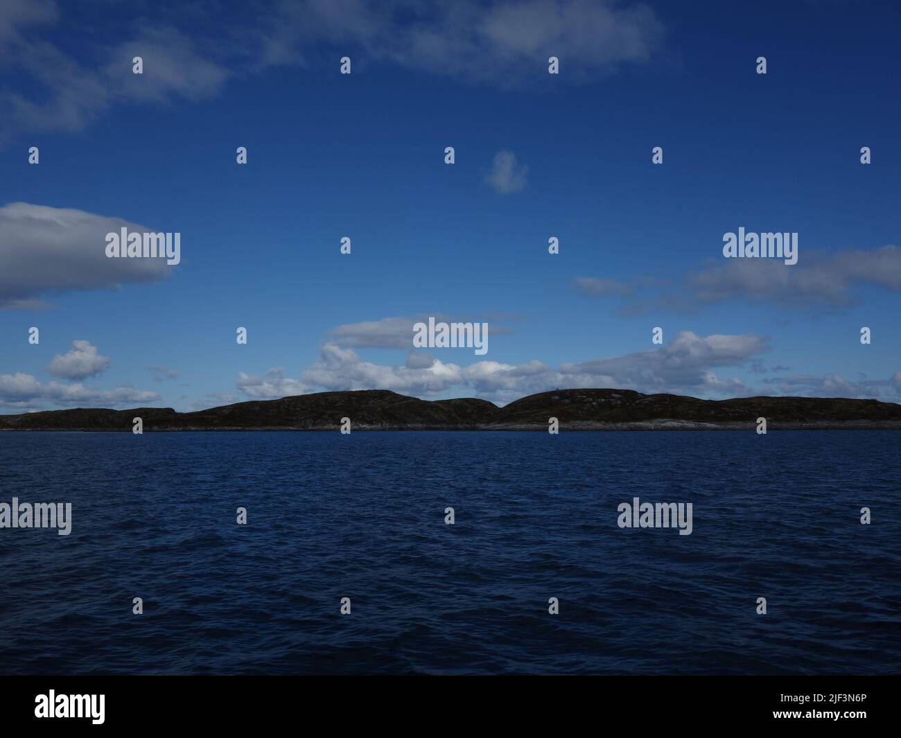 The passenger boat travels between islets and reefs to the next ...