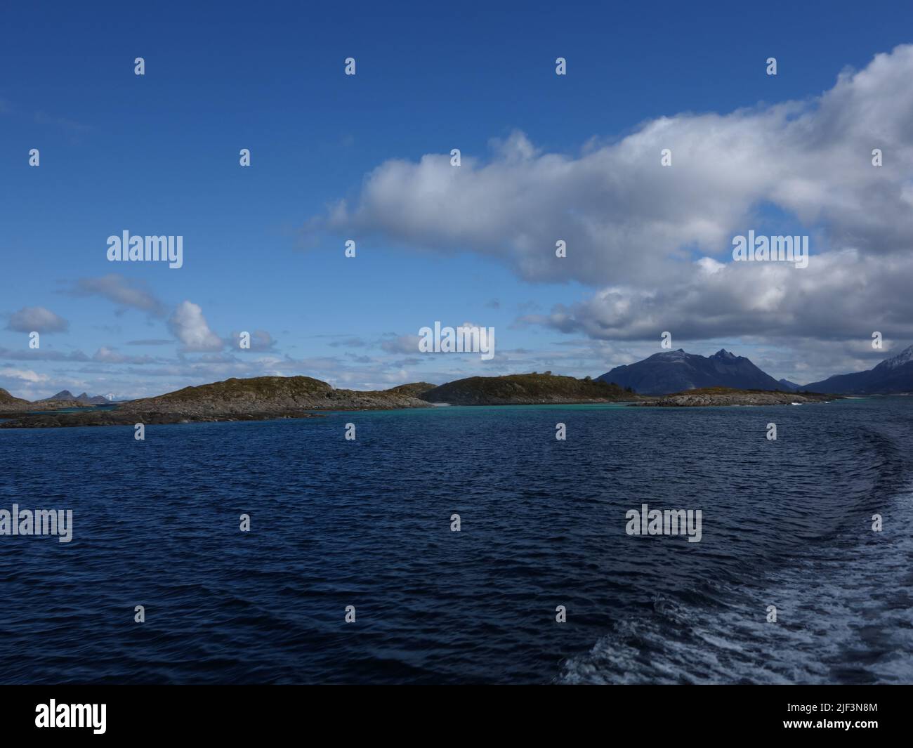 The passenger boat travels between islets and reefs to the next ...