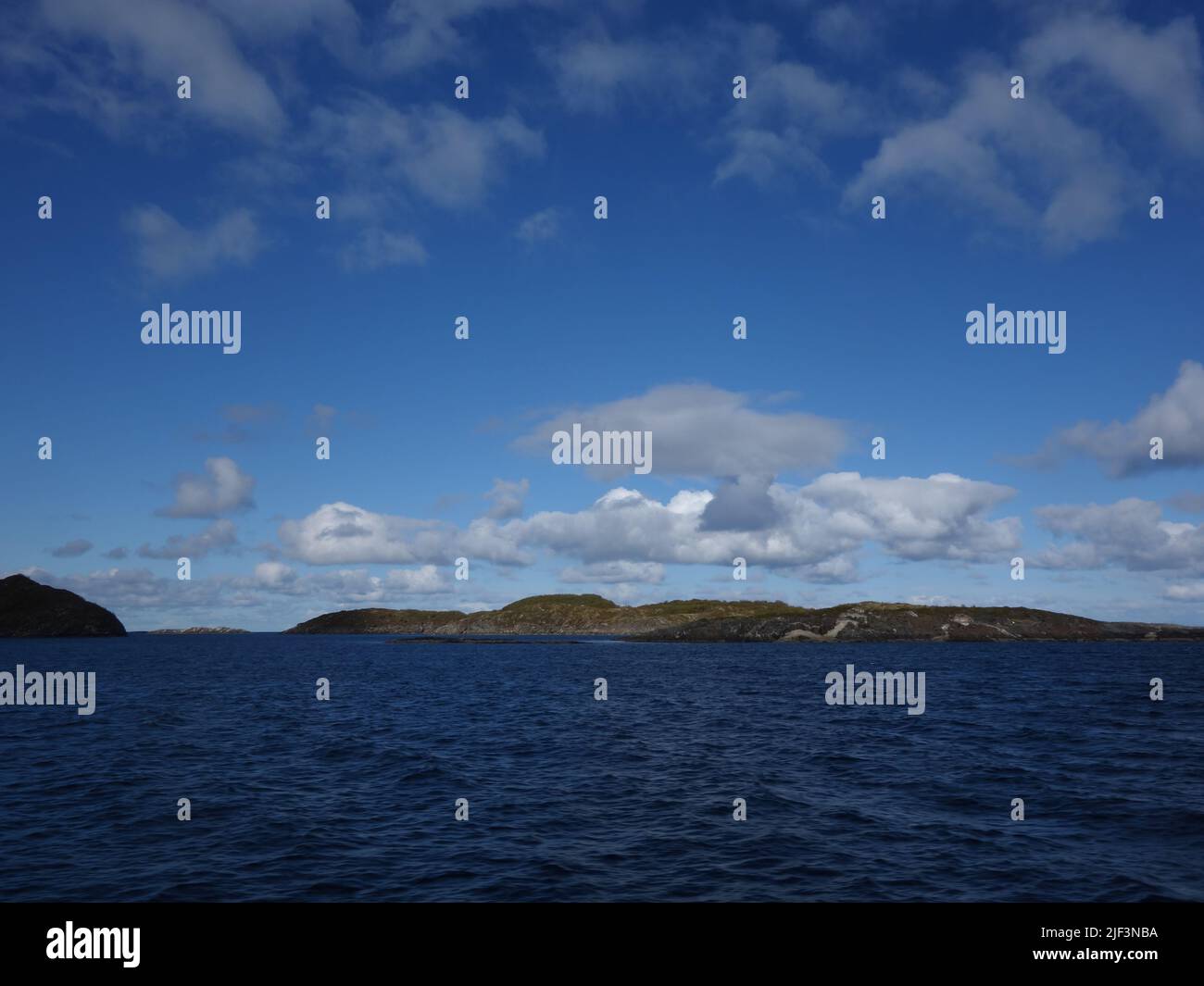 The passenger boat travels between islets and reefs to the next ...