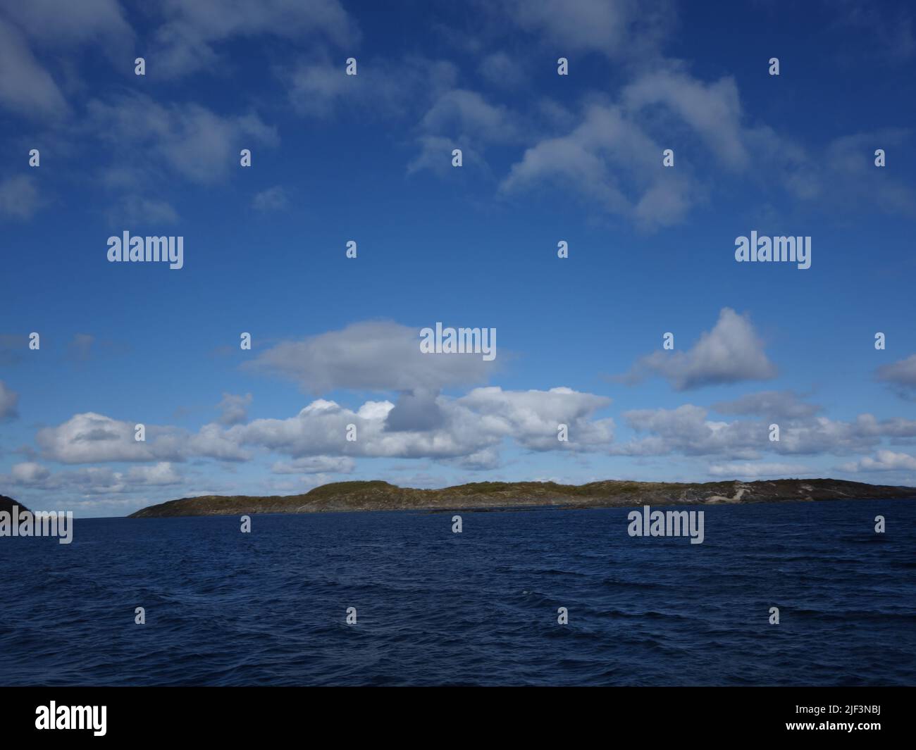 The passenger boat travels between islets and reefs to the next ...
