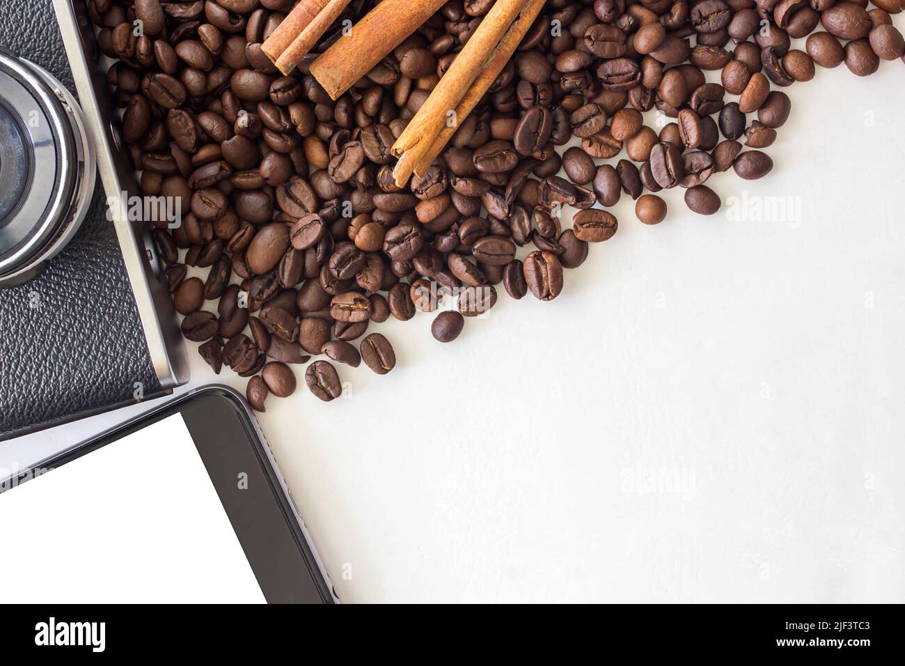 Smart phone,camera and coffee beans on white background. top view Stock ...