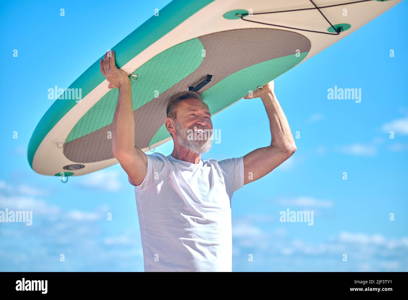 Surfboard on head hi-res stock photography and images - Alamy