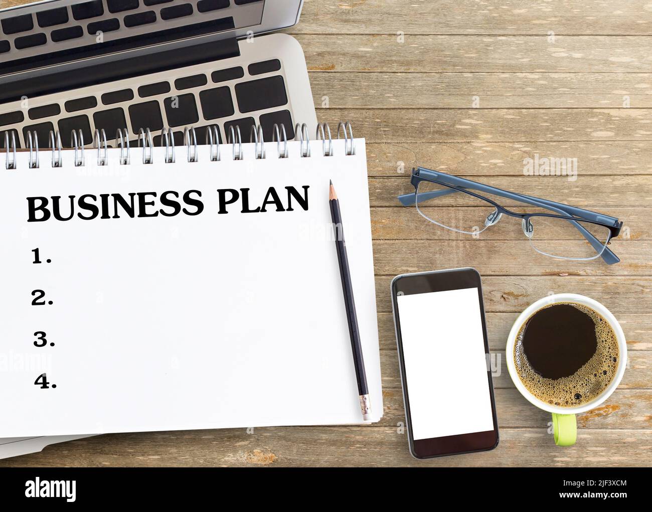 Flat lay, BUSINESS PLAN concept with laptop,smart phone,cup of coffee ...