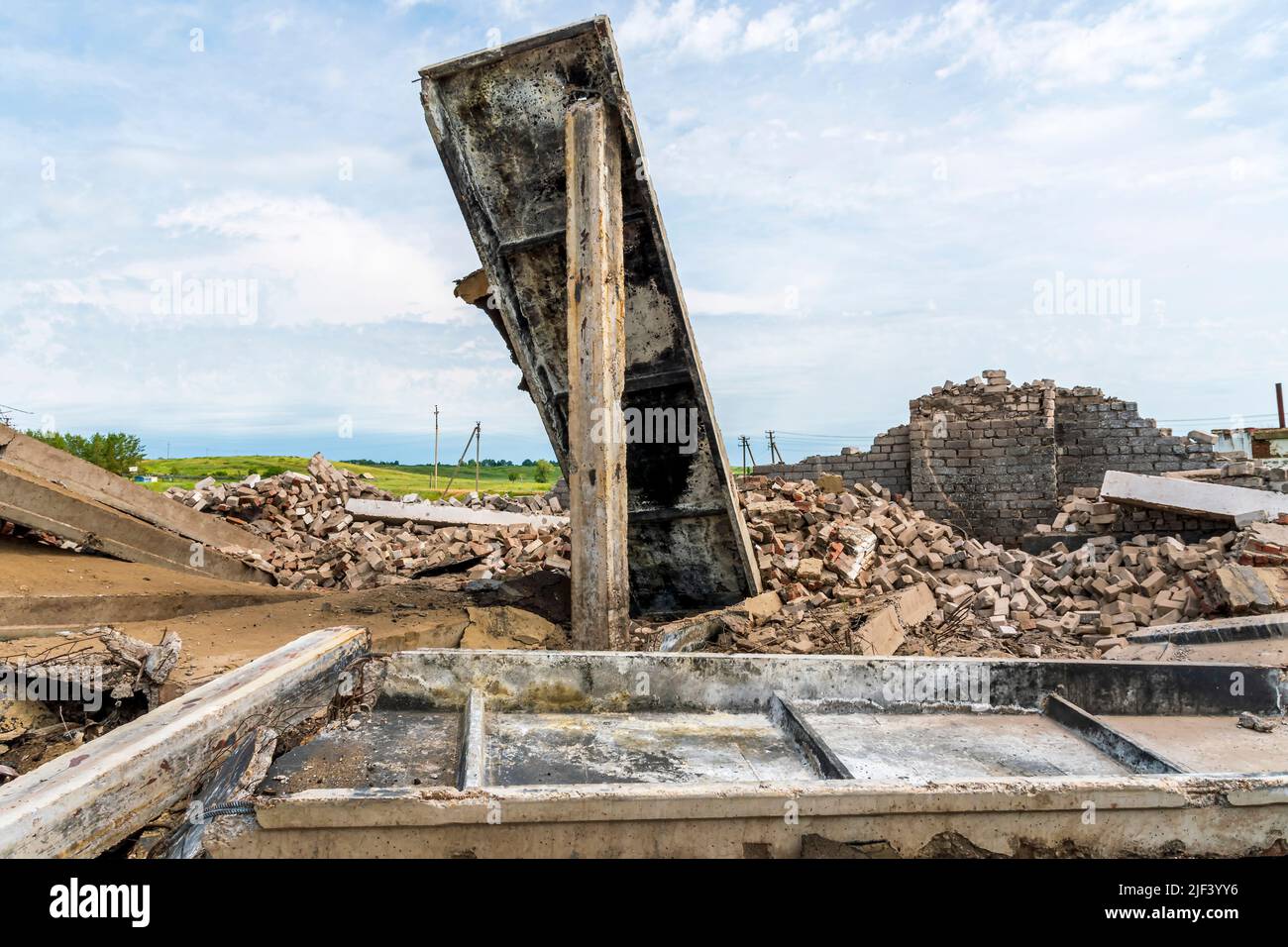 Old ruins of building. Fragments of bricks and reinforced concrete ...