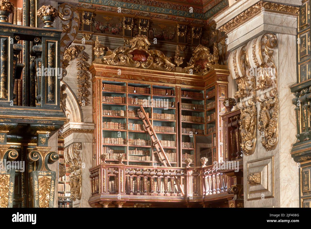 Shelves with old books inside the Biblioteca Joanina, Joanine Library ...