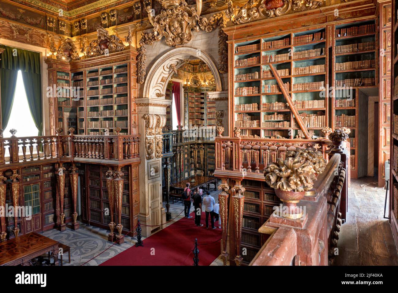 Shelves with old books inside the Biblioteca Joanina, Joanine Library ...