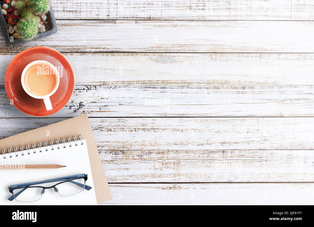 Wood office desk table with notebook, cup of coffee and glasses,flat ...