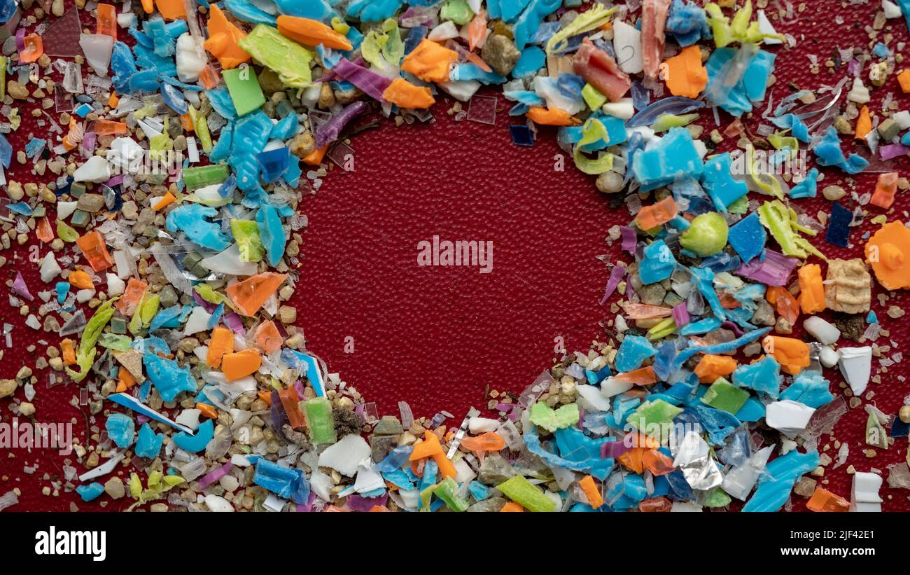Close-up on micro plastic particles with a circle for text in the ...