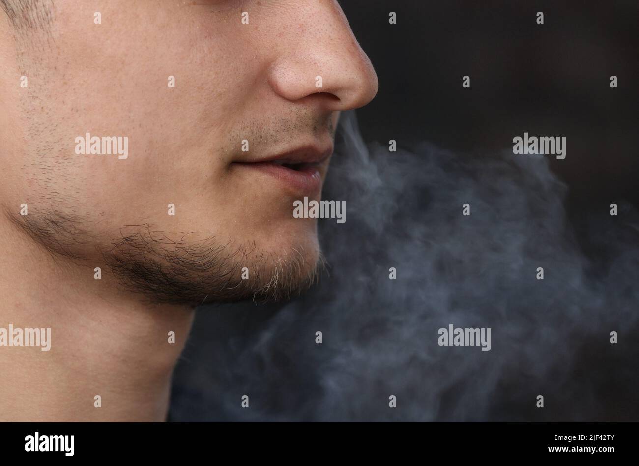 Young male man vaping in the street hi-res stock photography and images ...